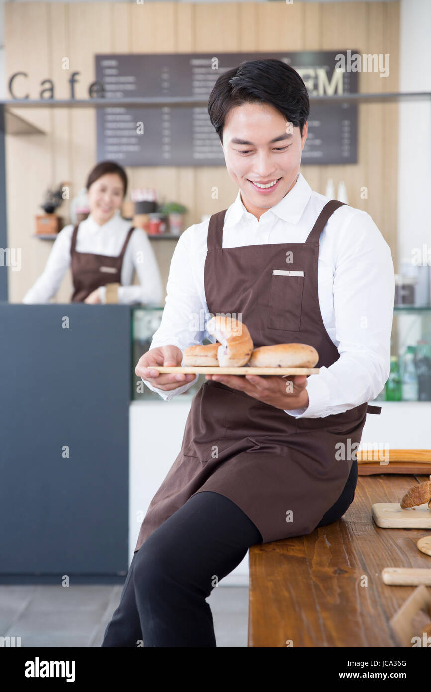 Smiling employees at bakery Stock Photo - Alamy