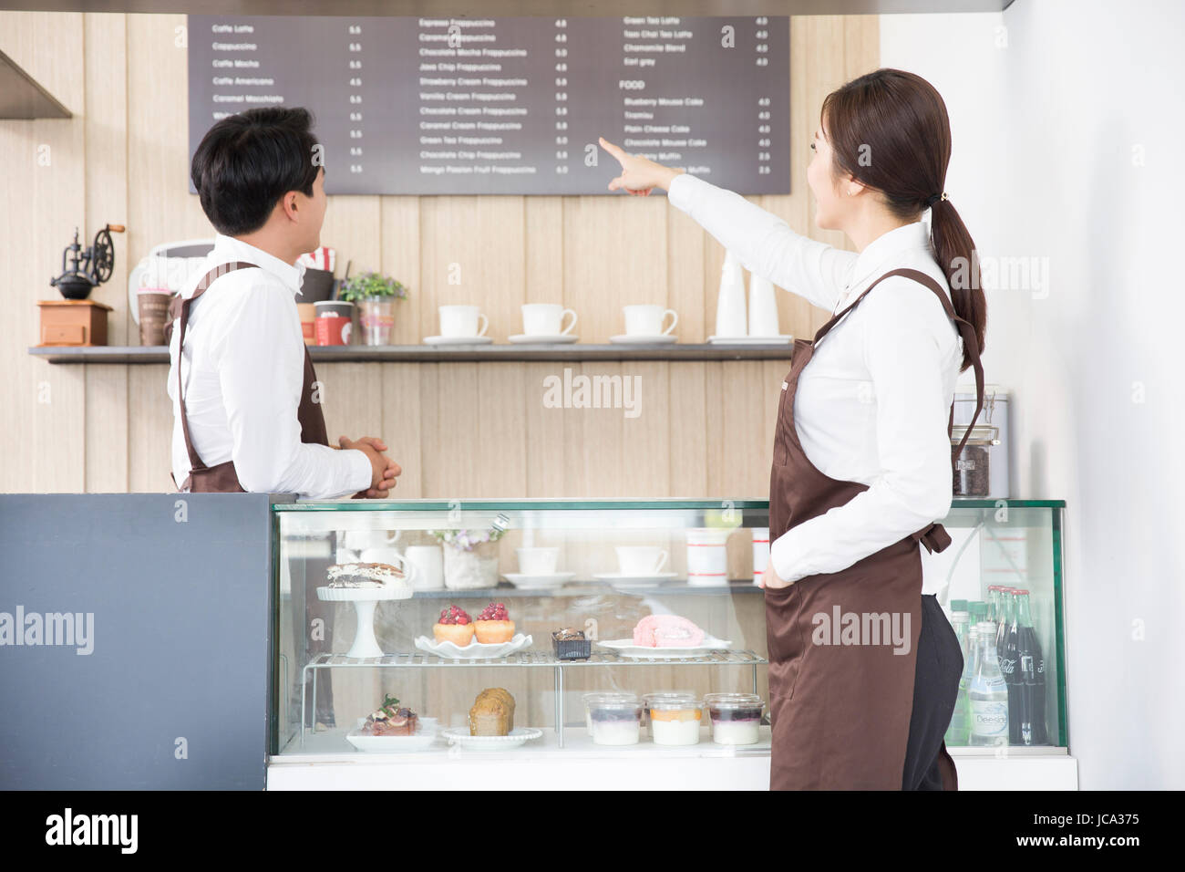 Smiling workers at cafe Stock Photo - Alamy