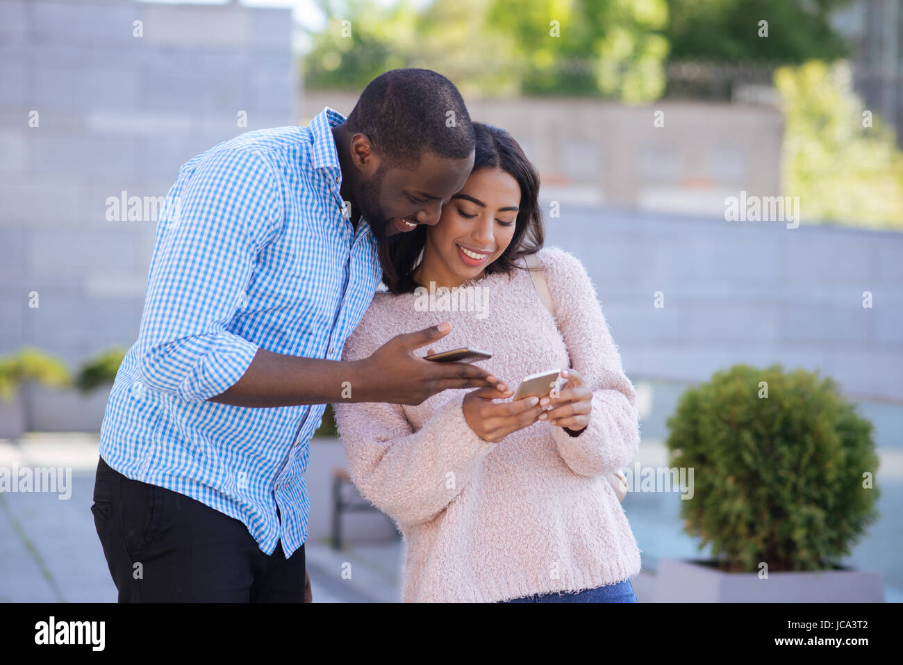 Young passionate people exchanging contacts Stock Photo - Alamy