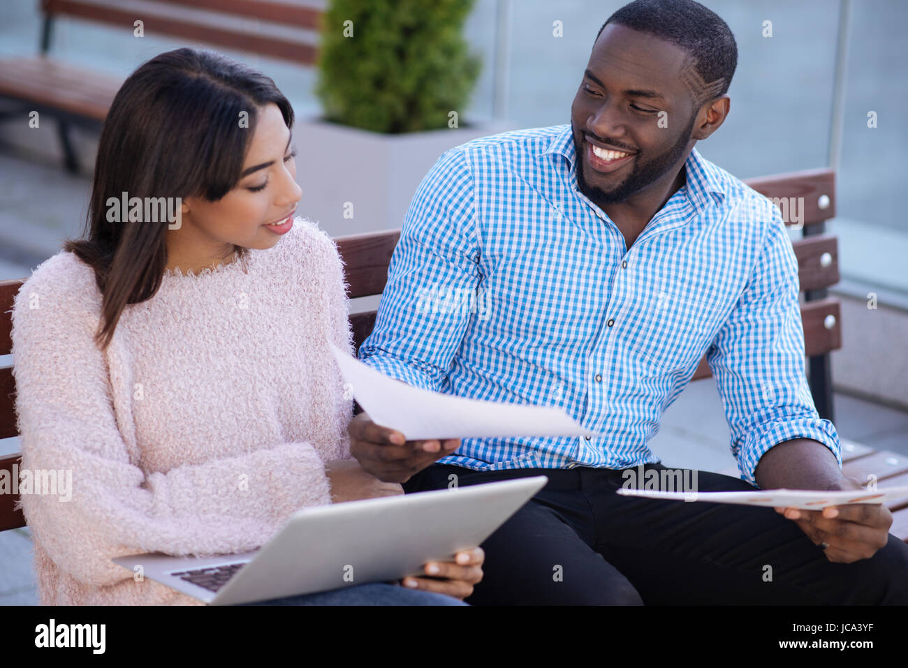 Energetic charming friends working on startup concept Stock Photo - Alamy