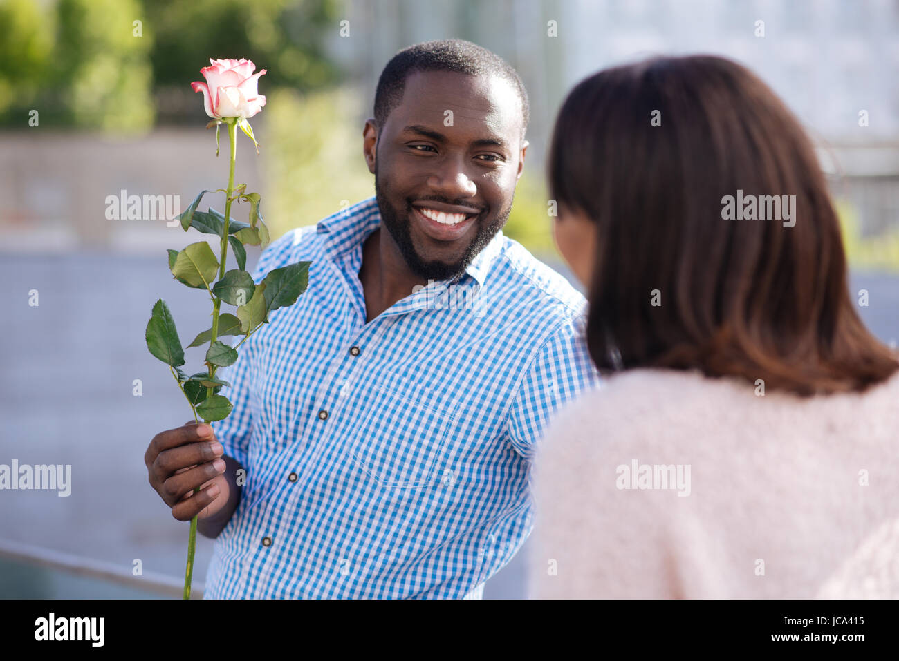 Bright handsome guy being a real gentleman Stock Photo - Alamy