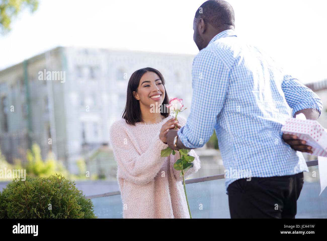 Clever attentive guy making a surprise for anniversary Stock Photo - Alamy