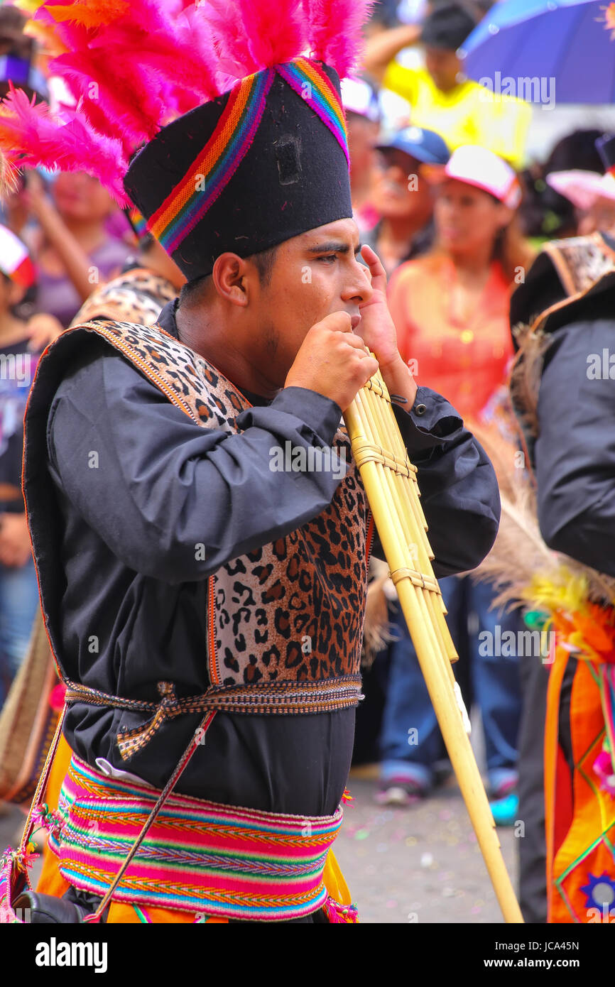 Local man playing flute during Festival of the Virgin de la Candelaria ...