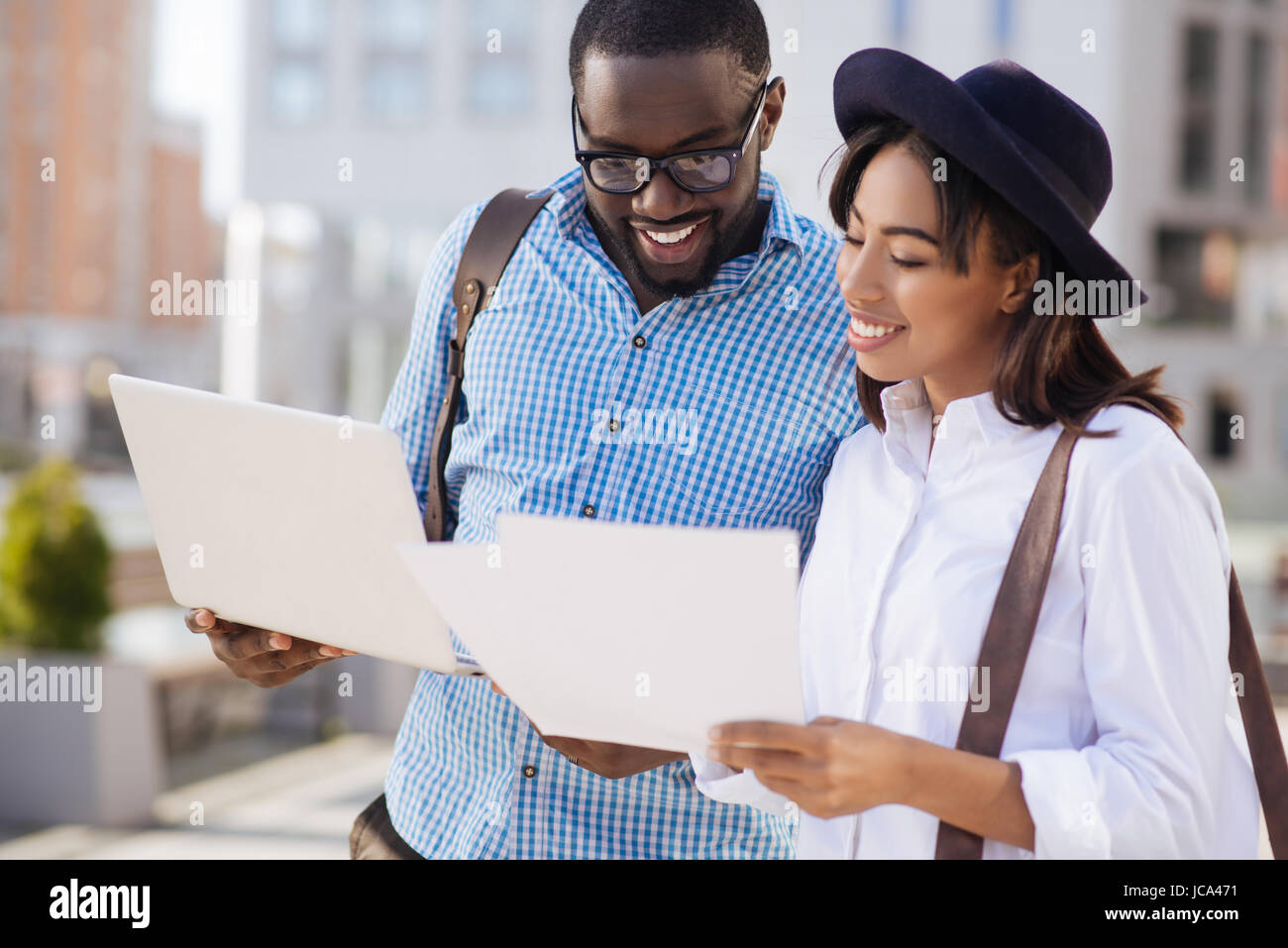 Motivated competent people reading a business plan Stock Photo - Alamy