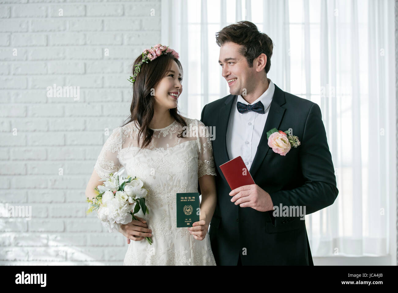 Smiling multicultural wedding couple Stock Photo - Alamy