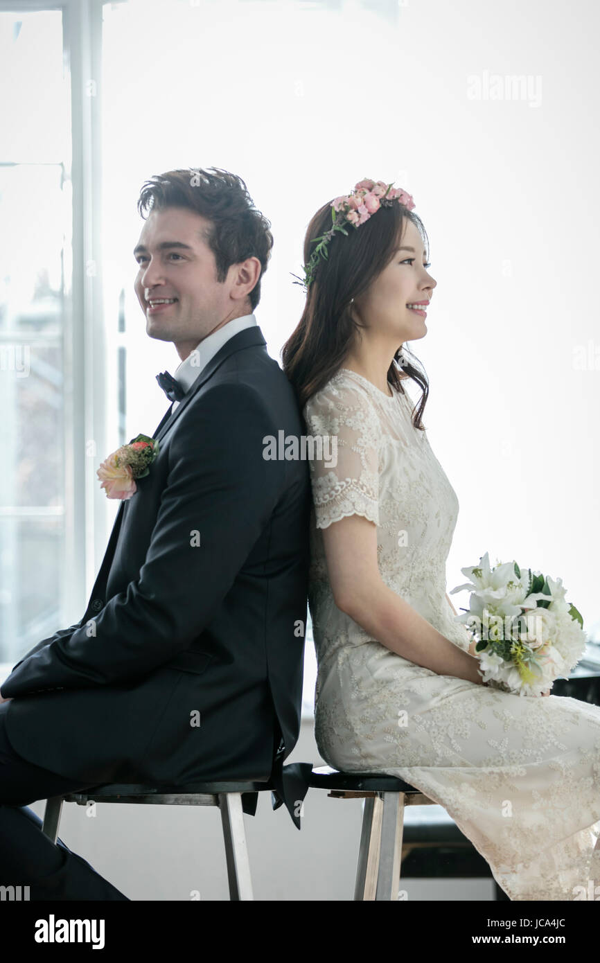 Smiling multicultural wedding couple Stock Photo - Alamy