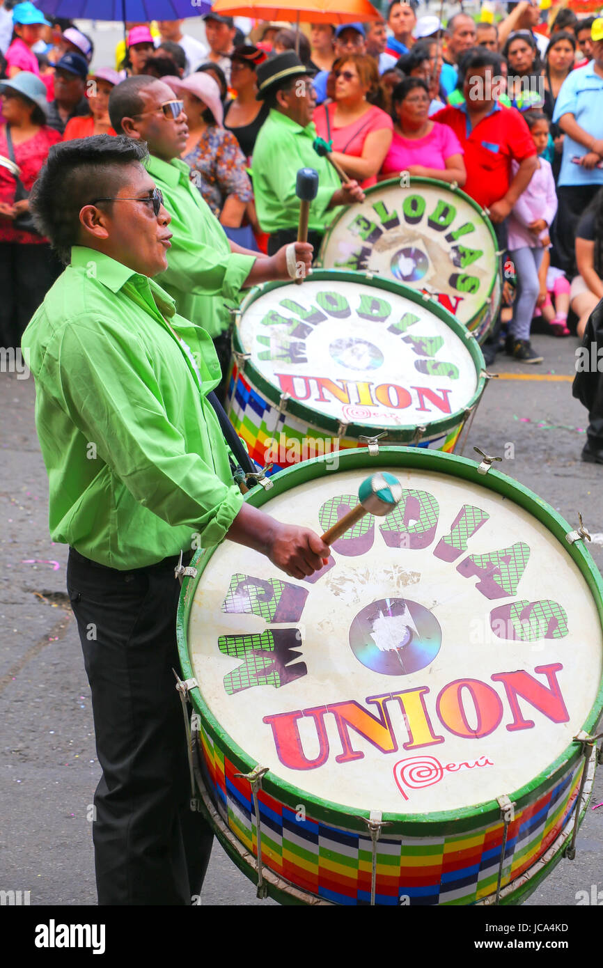 Local men playing drums during Festival of the Virgin de la Candelaria ...