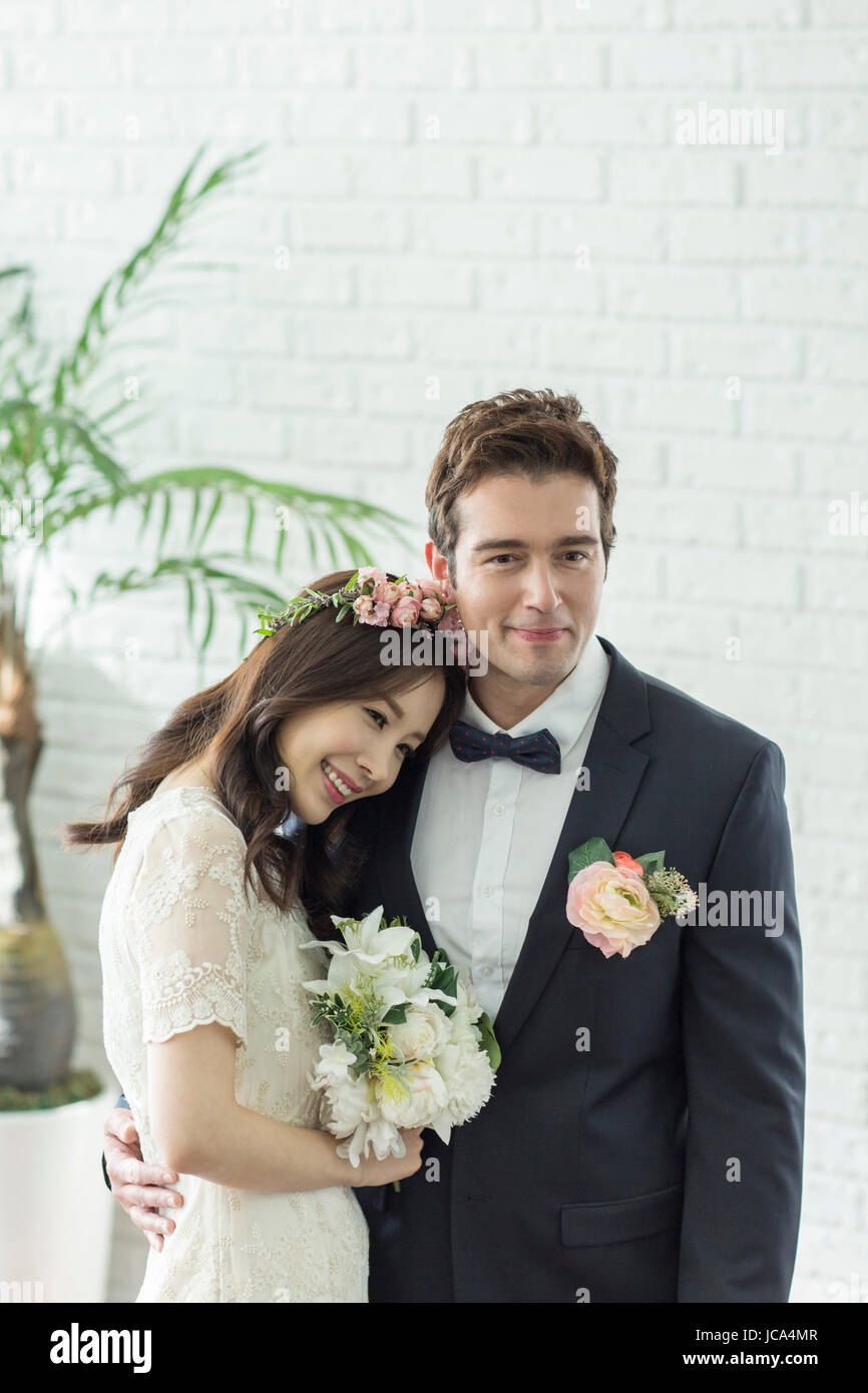 Loving multicultural wedding couple Stock Photo - Alamy