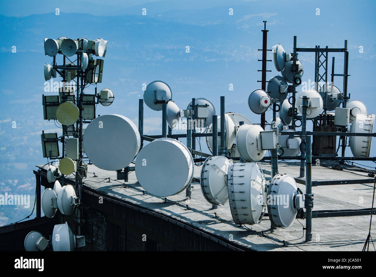 Telecommunication tower with lots of different antenna Stock Photo - Alamy