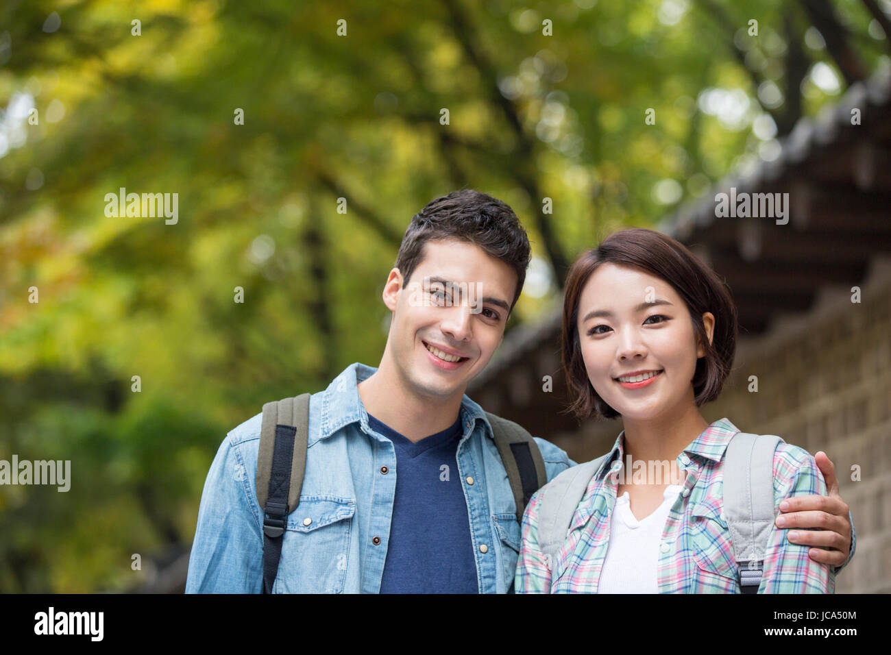 Portrait of smiling multicultural couple Stock Photo - Alamy
