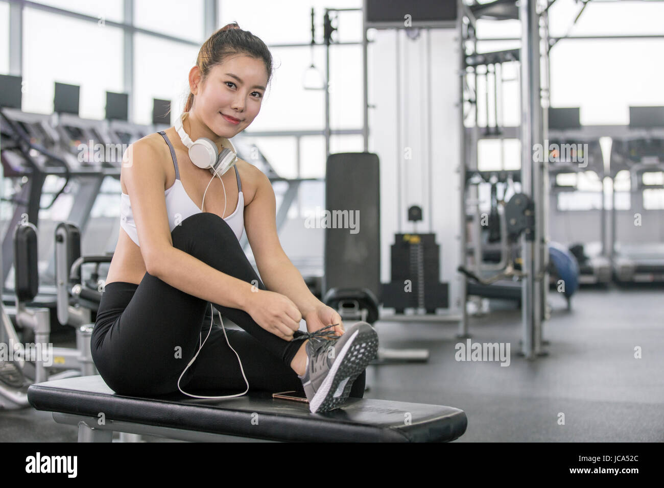 Young woman ready to exercise at gym Stock Photo - Alamy