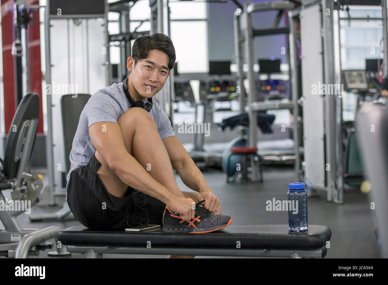 Smiling man ready to exercise Stock Photo - Alamy
