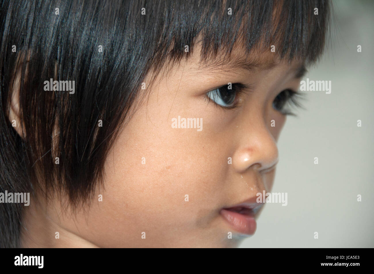 Young boy staring in to the distance hi-res stock photography and ...