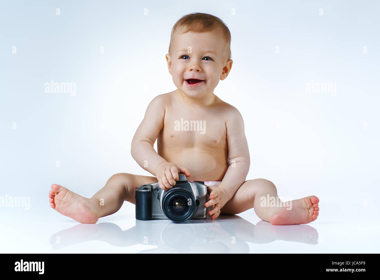 Eight month baby trying to be photographer and playing with camera on ...