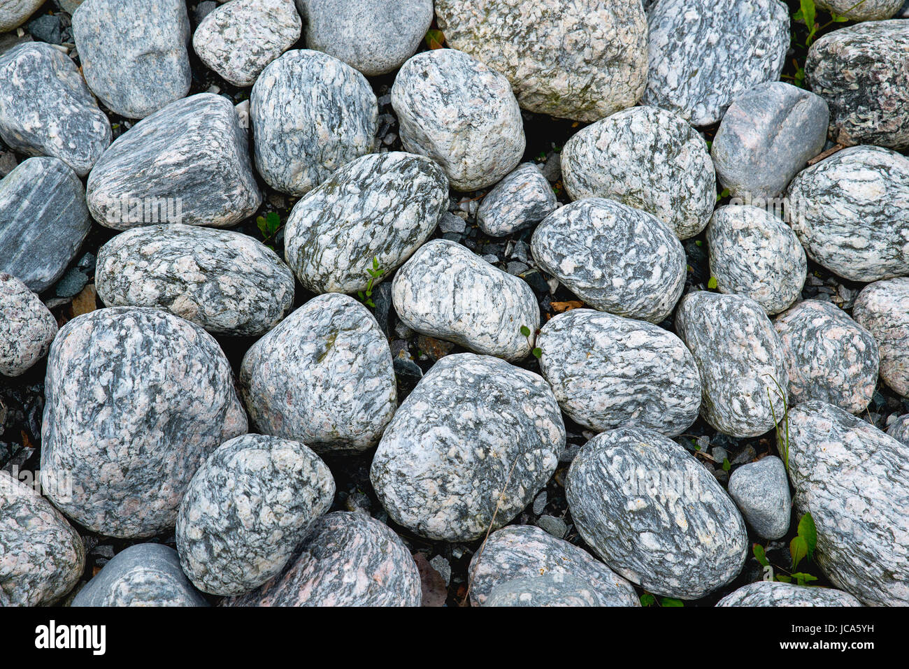 Rounded white stones Stock Photo - Alamy
