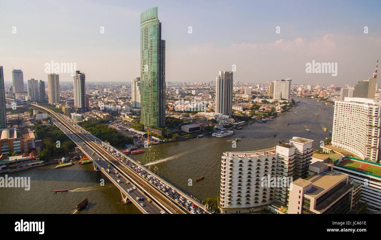 aerial view of sathorn bridge crossing chao praya river in heart of ...
