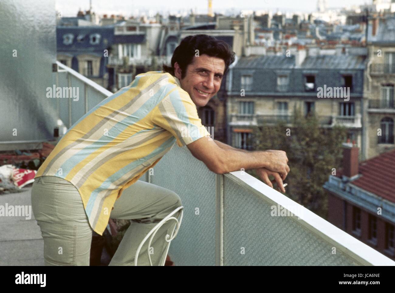 French singer Gilbert Bécaud on the terrace of his apartment located 6 ...