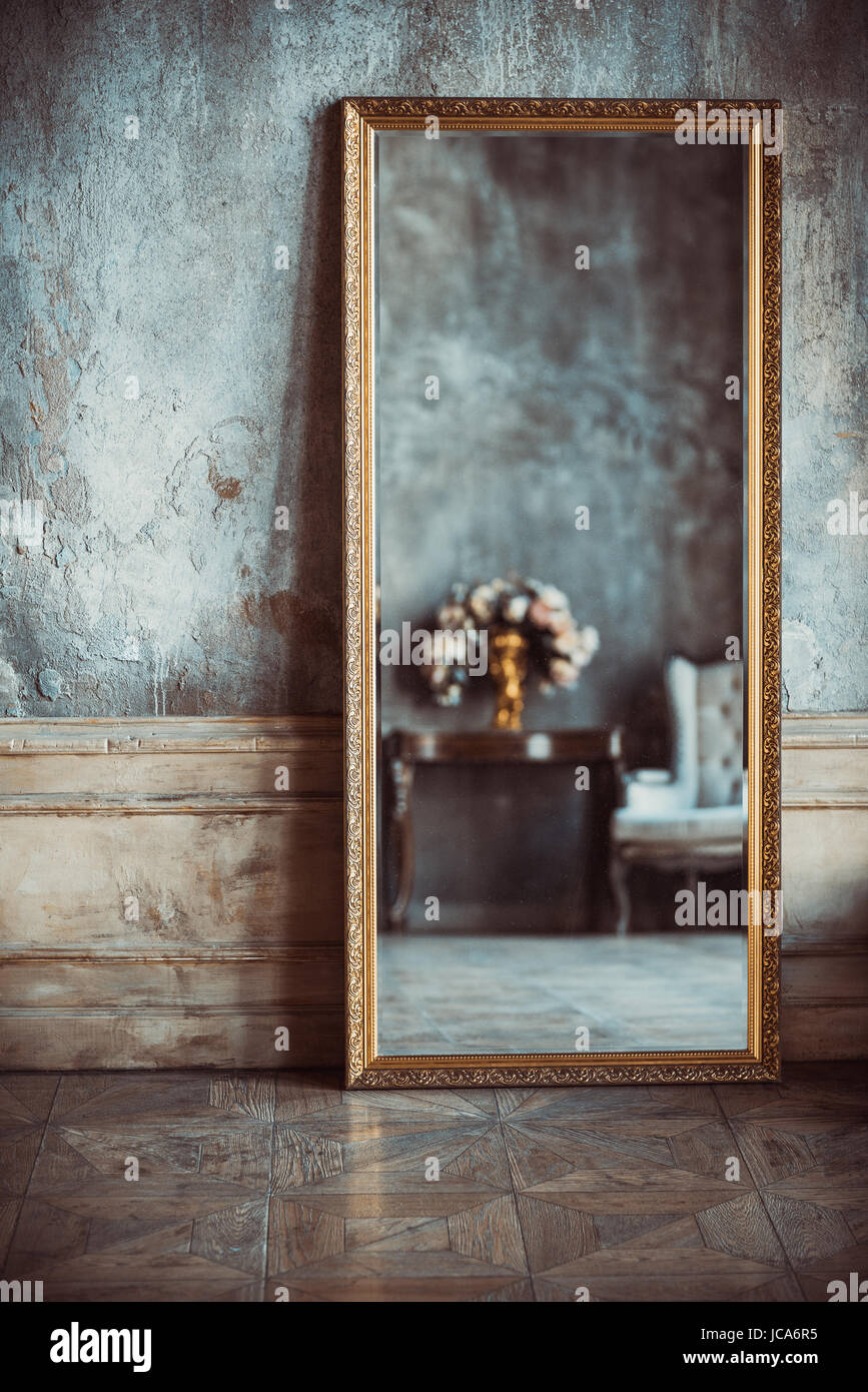 Vintage style interior details. Old wall and mirror with reflection ...