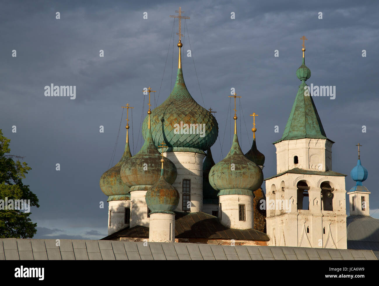 view on domes of the old russian church against dramatic cloudy sky ...