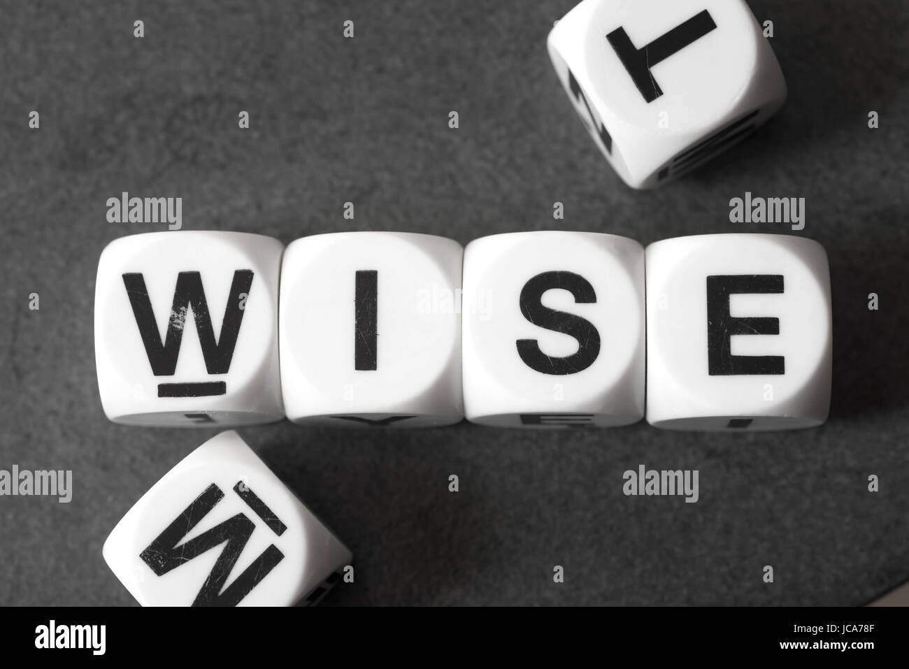 word wise on white toy cubes Stock Photo - Alamy
