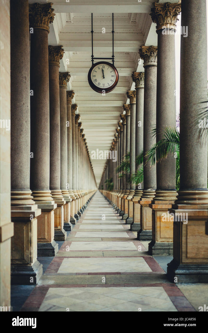 Infinite perspective with classic columns and clock in front ...