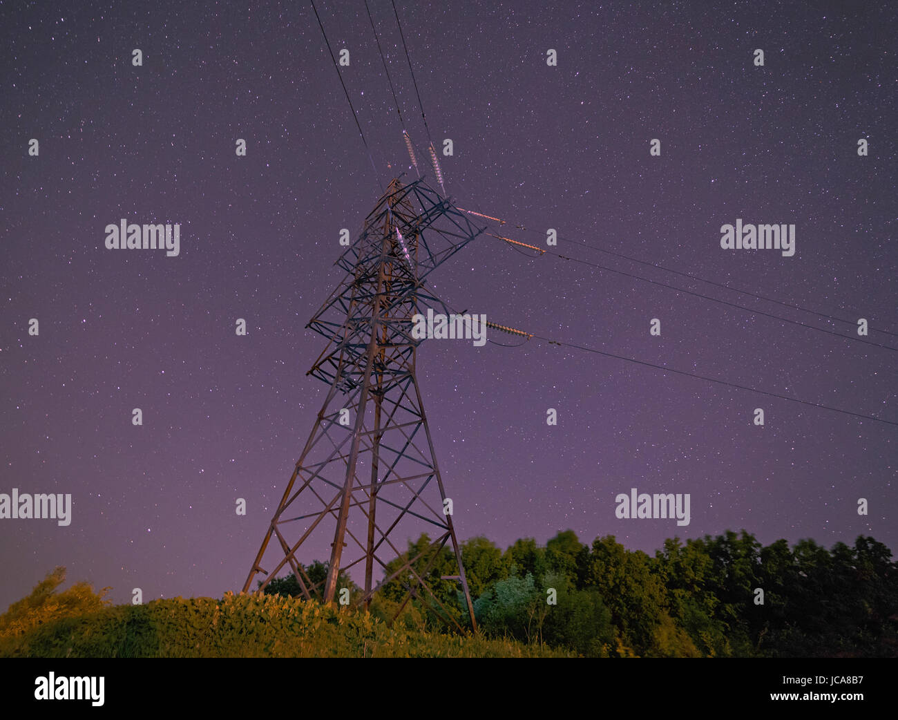 electricity pylon against night sky Stock Photo - Alamy