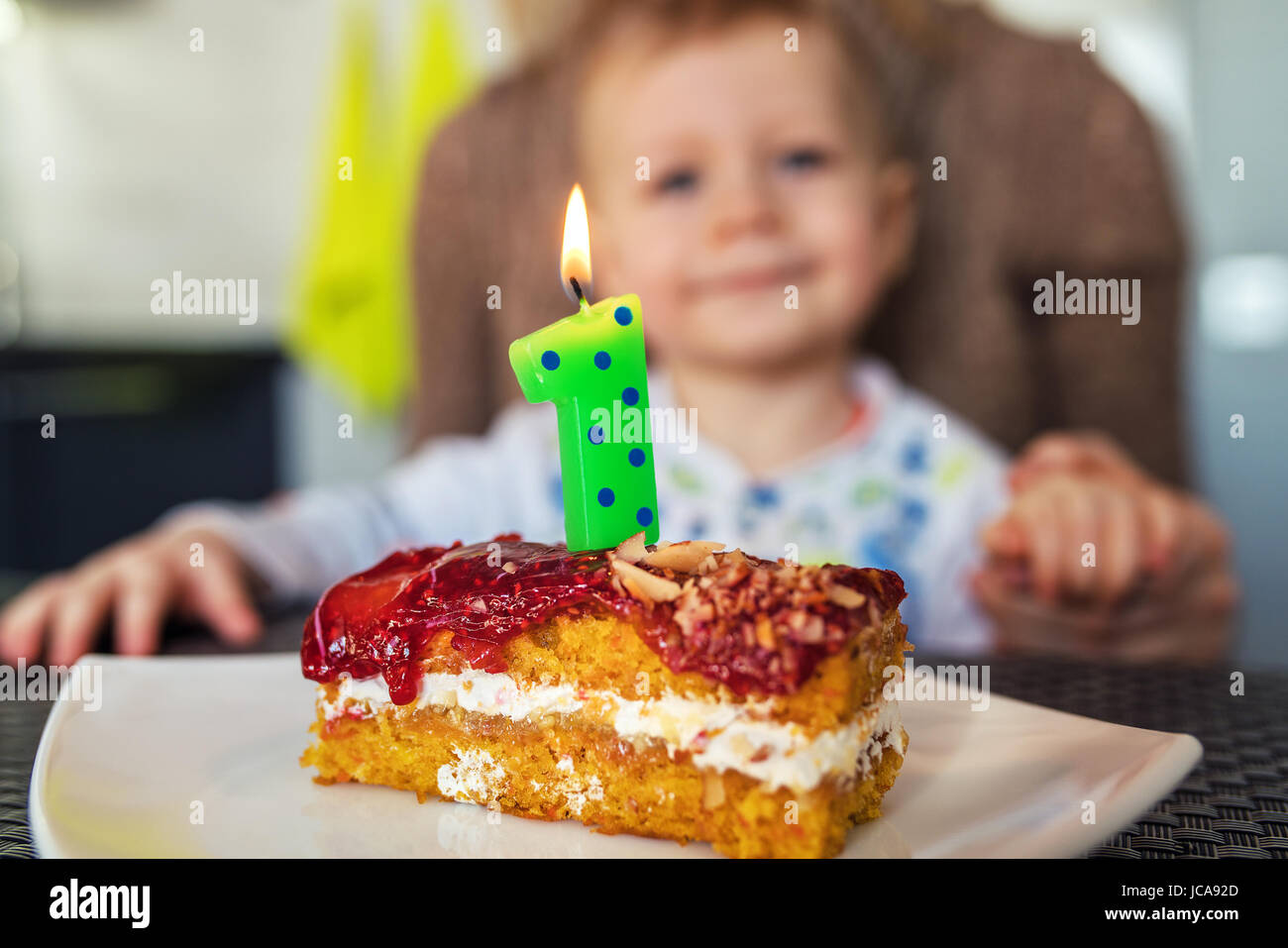 One year baby celebrating birthday. Focus on cake with candle Stock ...
