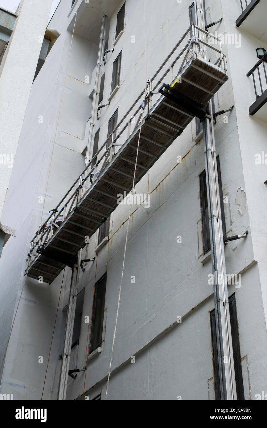 Looking up underneath an outside construction platform for workers ...