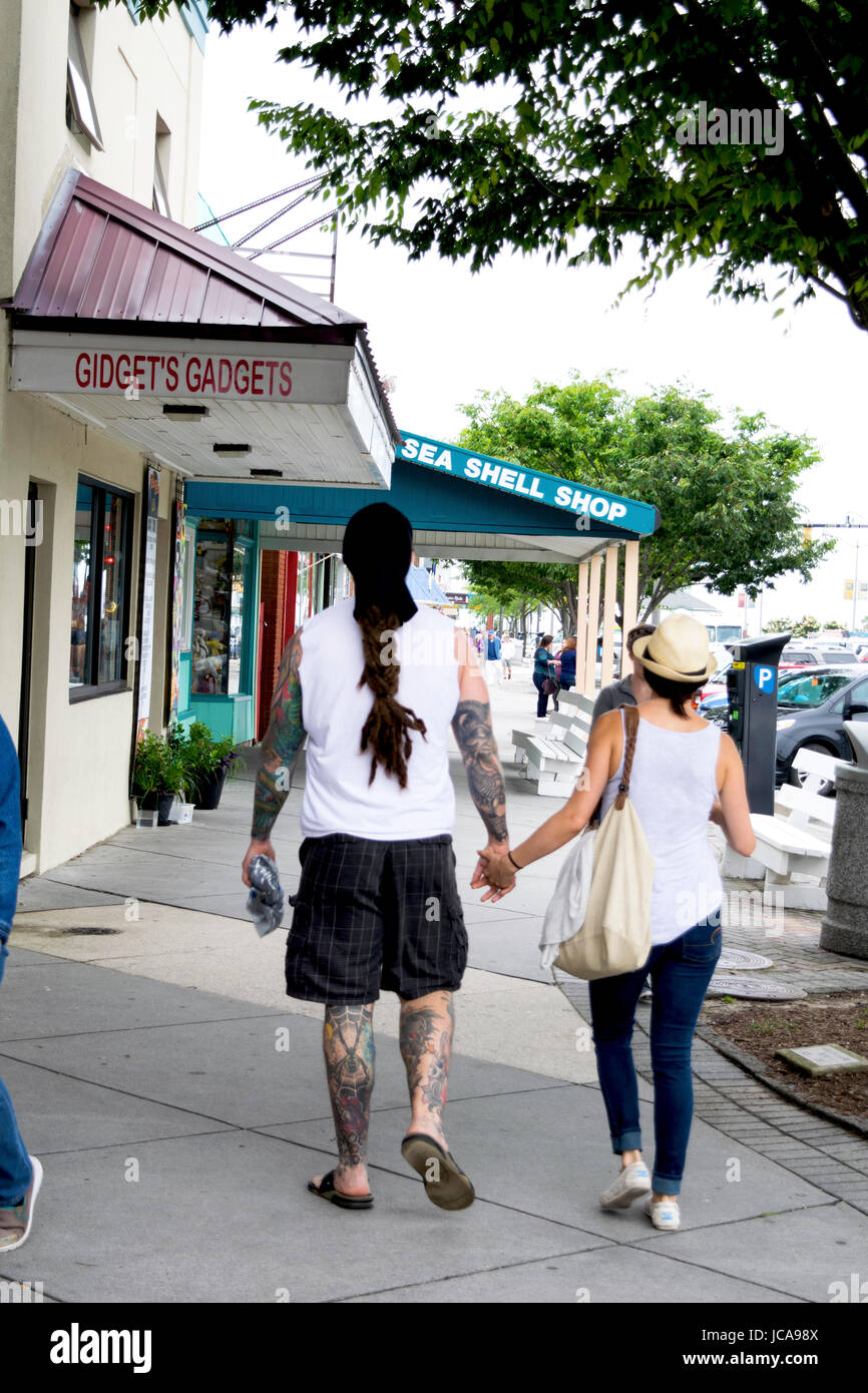 Young couple strolling hand in hand Stock Photo - Alamy