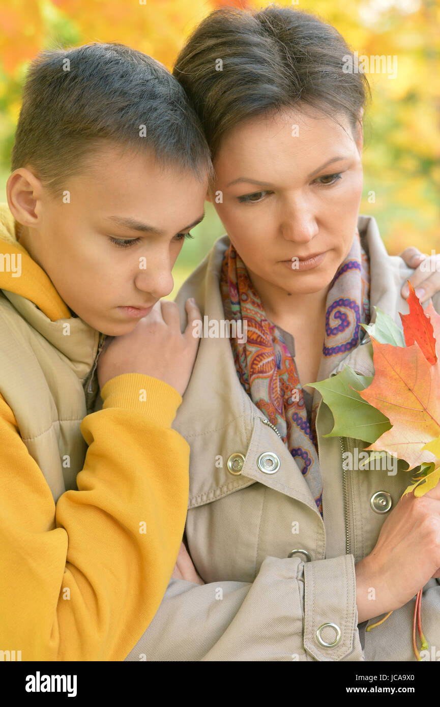 Mother hugging son sad hi-res stock photography and images - Alamy
