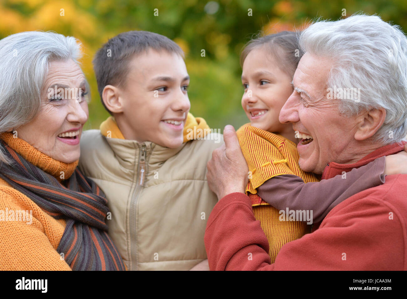 Family portrait of grandparents and grandchildren outdoors Stock Photo ...