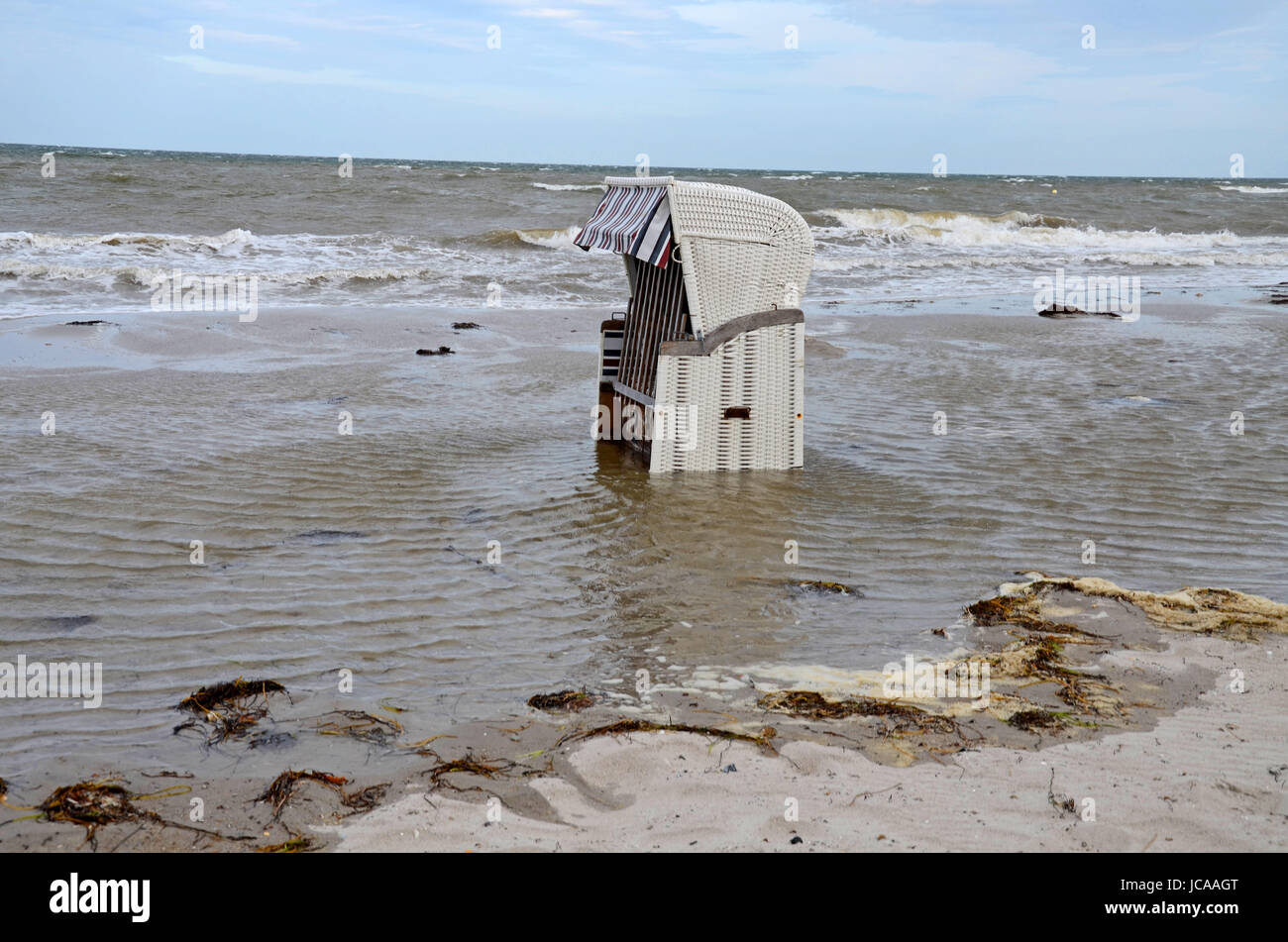 flooded beach chair Stock Photo - Alamy