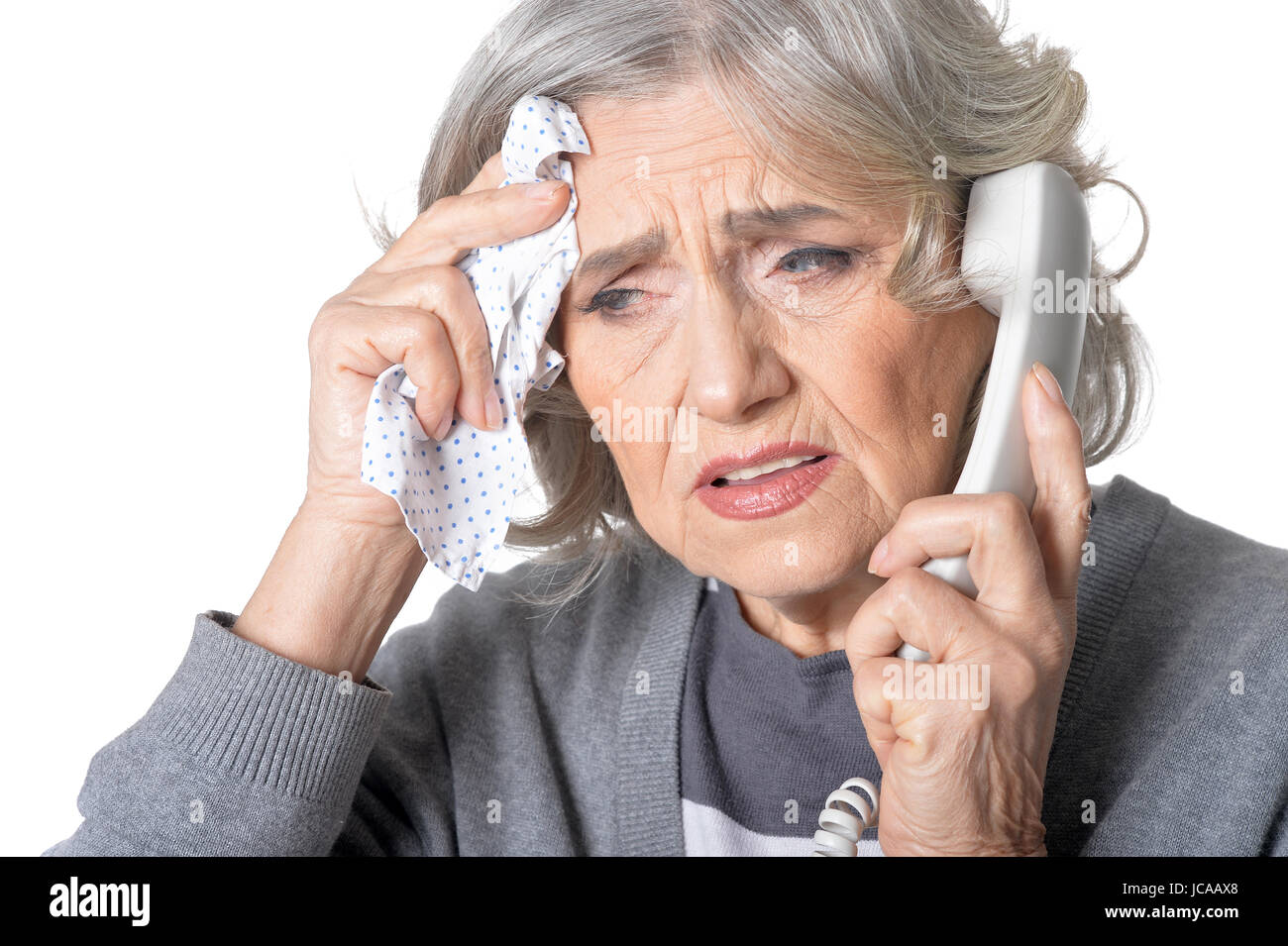Senior woman with headache talking on phone isolated on white ...