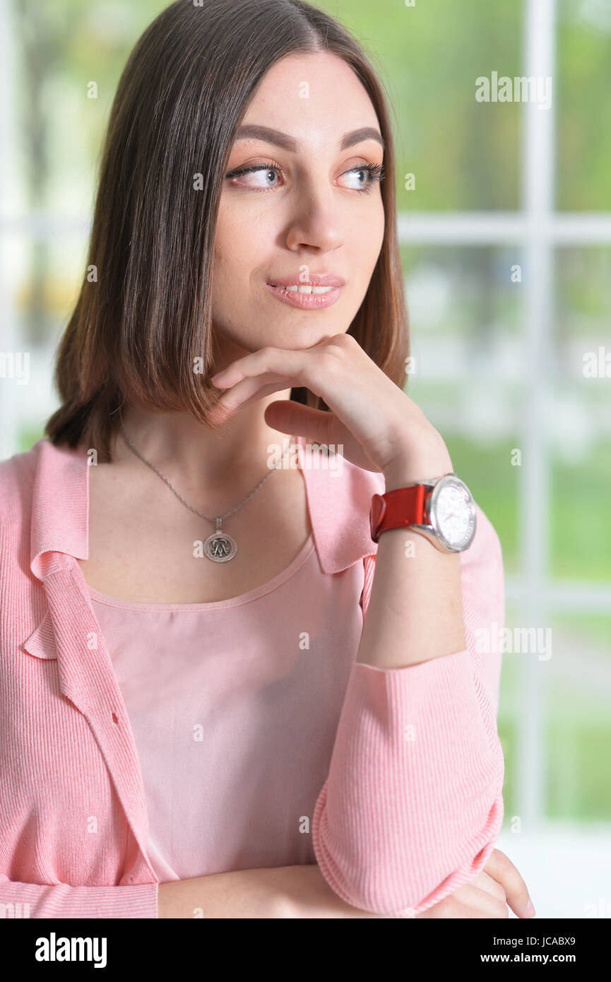 Portrait of a beautiful girl by the window Stock Photo - Alamy