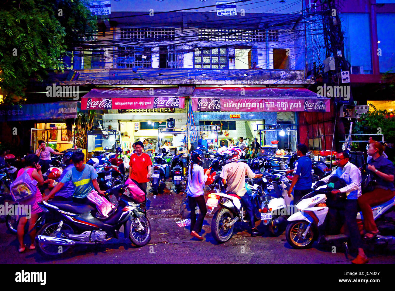 Motorcycle feeding stop food stalls Phnom Penh Stock Photo - Alamy