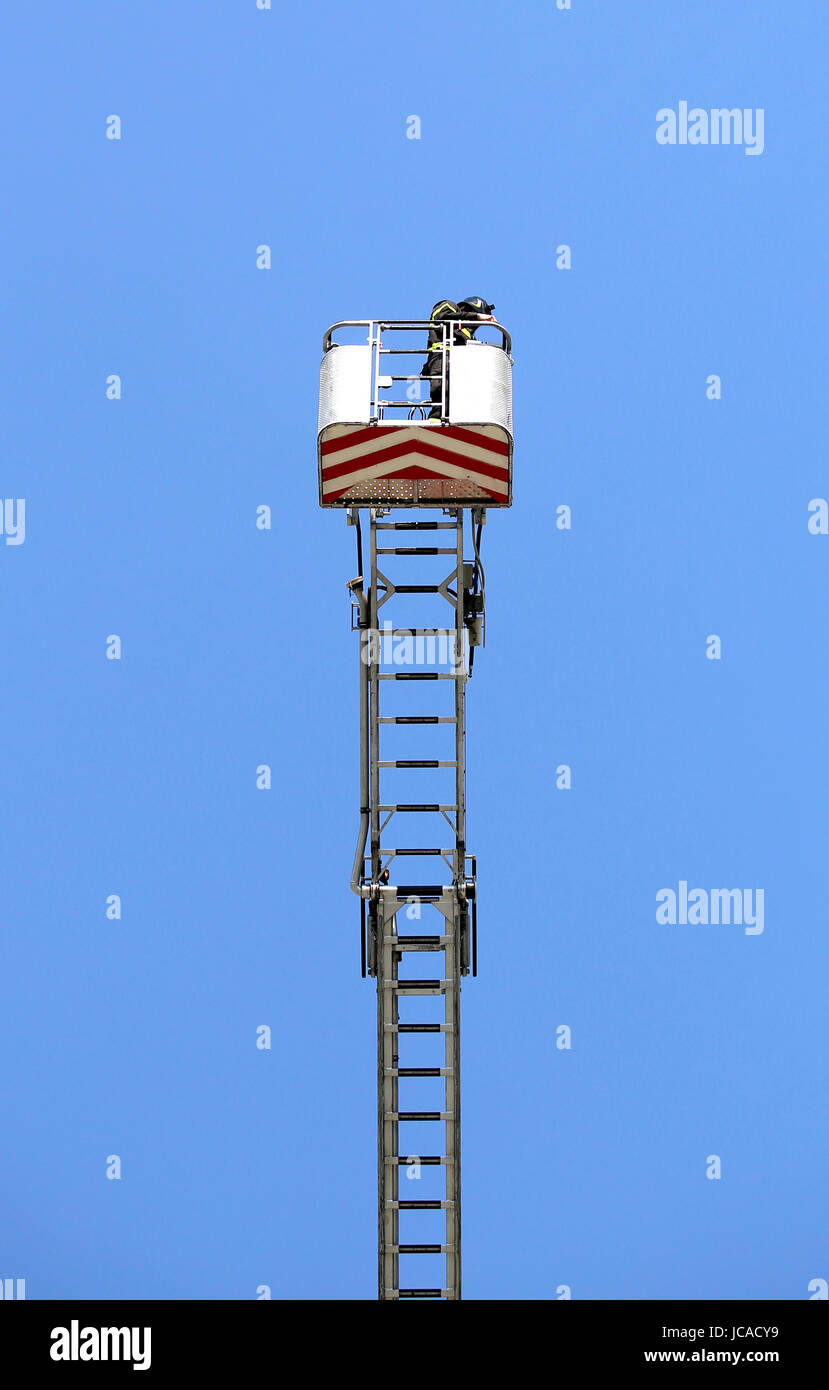 Metal Basket over the special very long ladder of a fire truck during ...