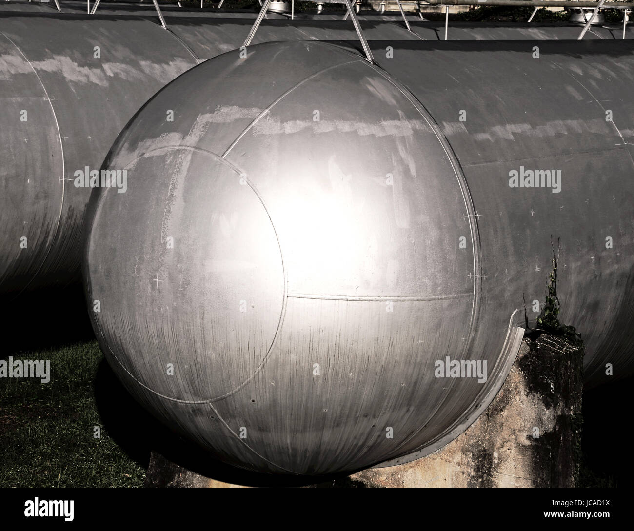 Gigantic steel tanks in the storage of flammable materials of the ...