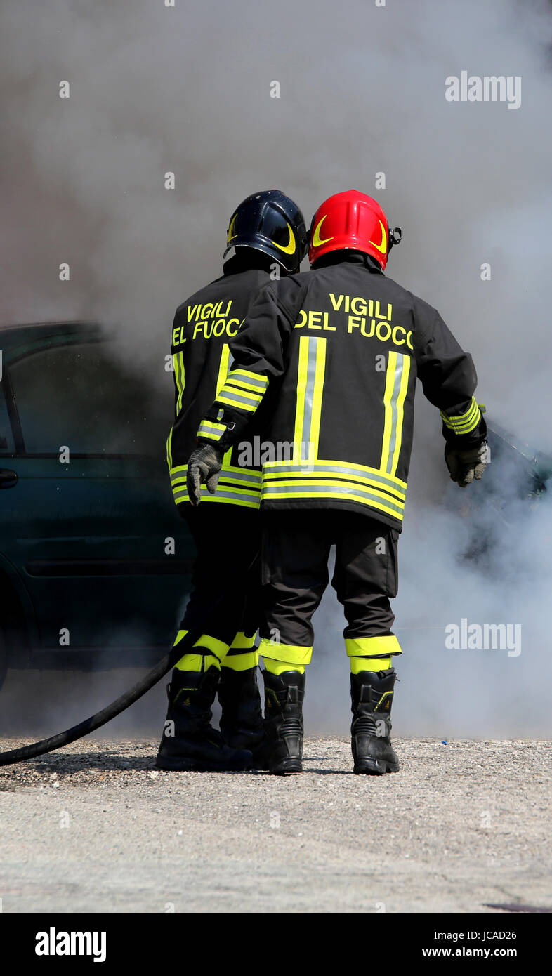 Two Italian fire brigade with the letter on the uniform meaning firemen ...