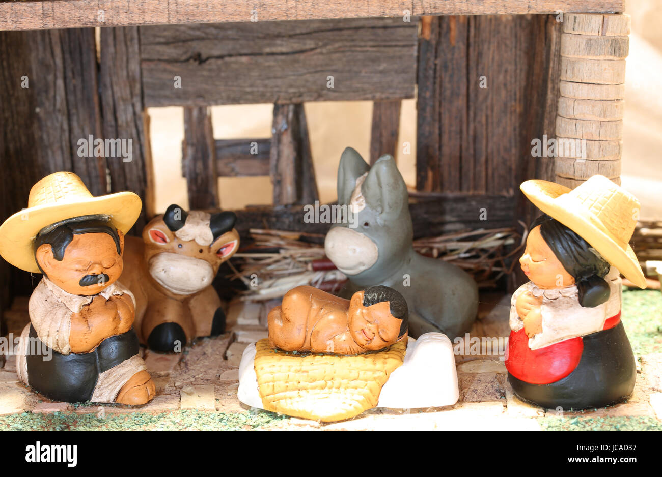 Mexican Nativity scene with the holy family with the statues of the ox ...