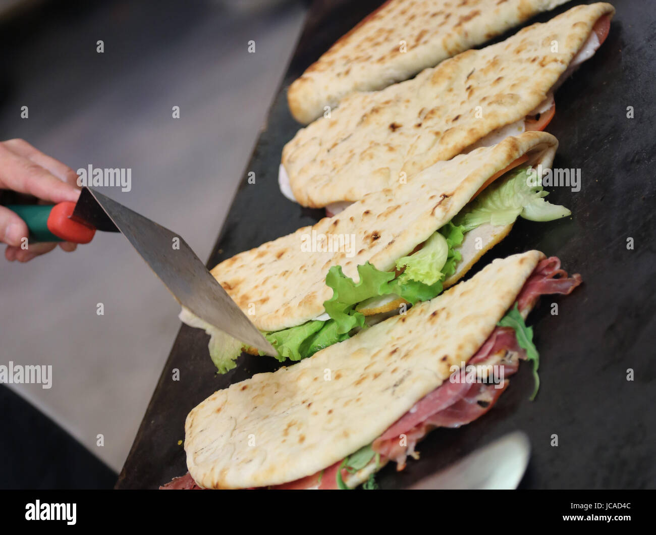 cook while cooking the piadina also called Spianata in Italian language ...