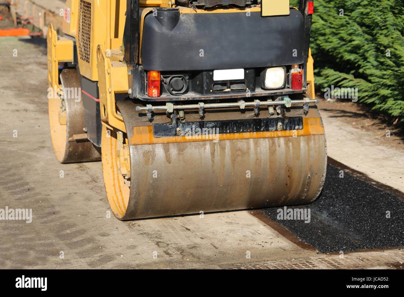 steamroller during the asphalt laying on the road construction site ...