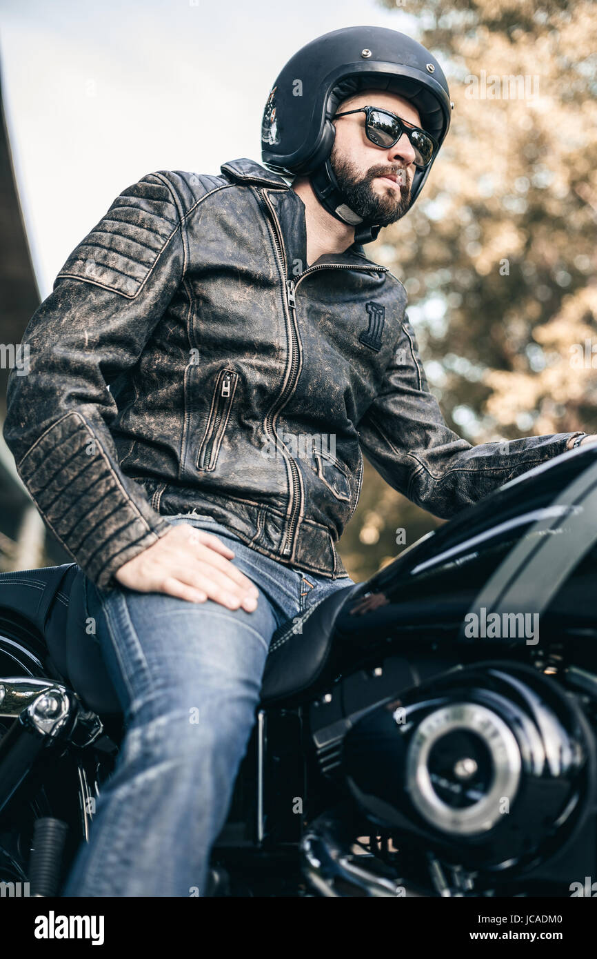 Handsome rider guy with beard in black biker jacket Stock Photo - Alamy