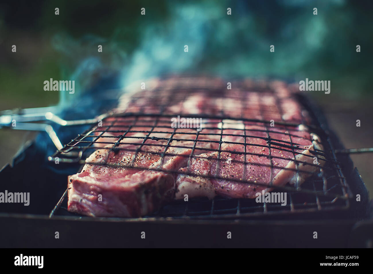 Grilling fresh entrecote pork Stock Photo - Alamy