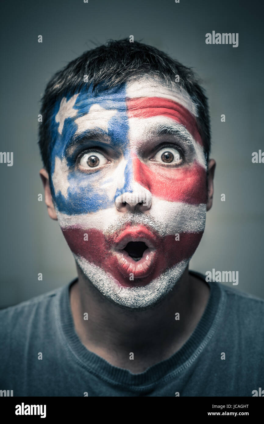 Portrait of surprised man with US flag painted on face Stock Photo - Alamy