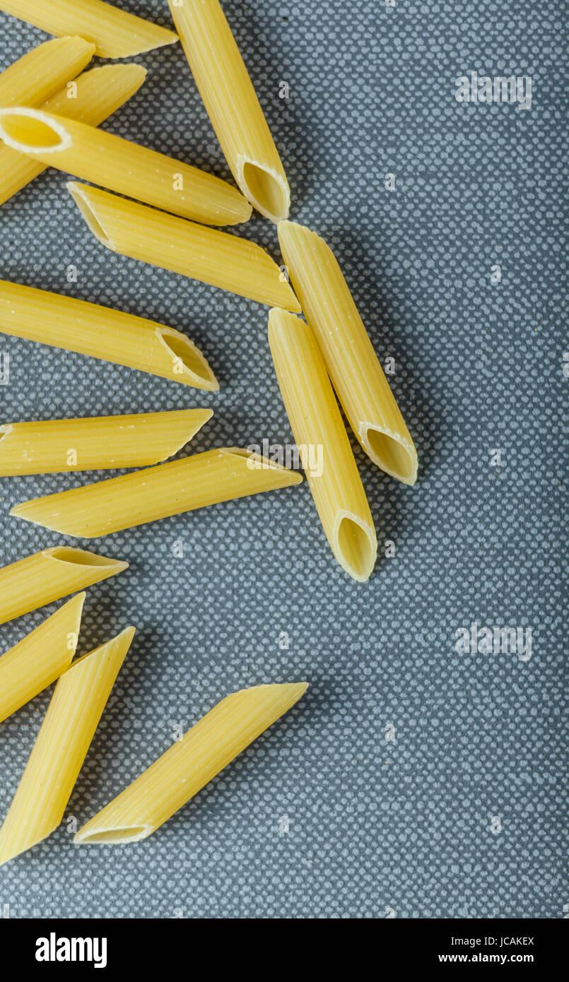 Dried Italian penne rigate pasta with its distinctive angle cut tubular ...