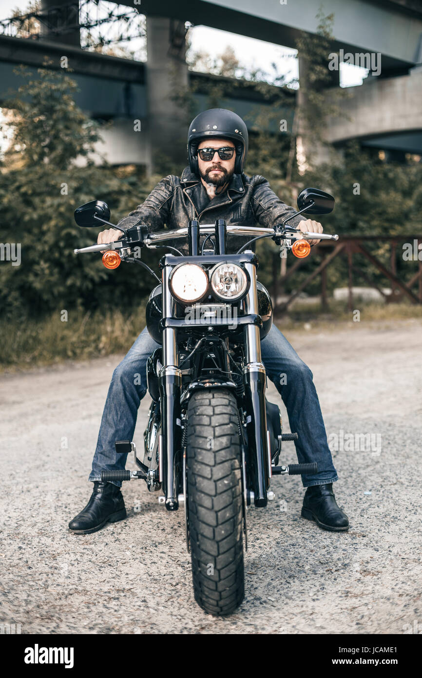 Handsome rider guy with beard in black biker jacket, sunglasses Stock ...