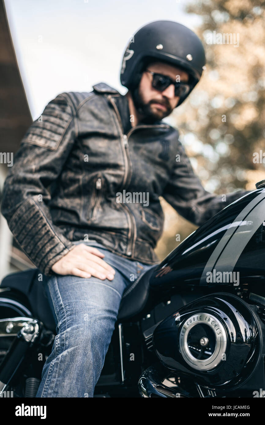 Handsome rider guy with beard in black biker jacket Stock Photo - Alamy