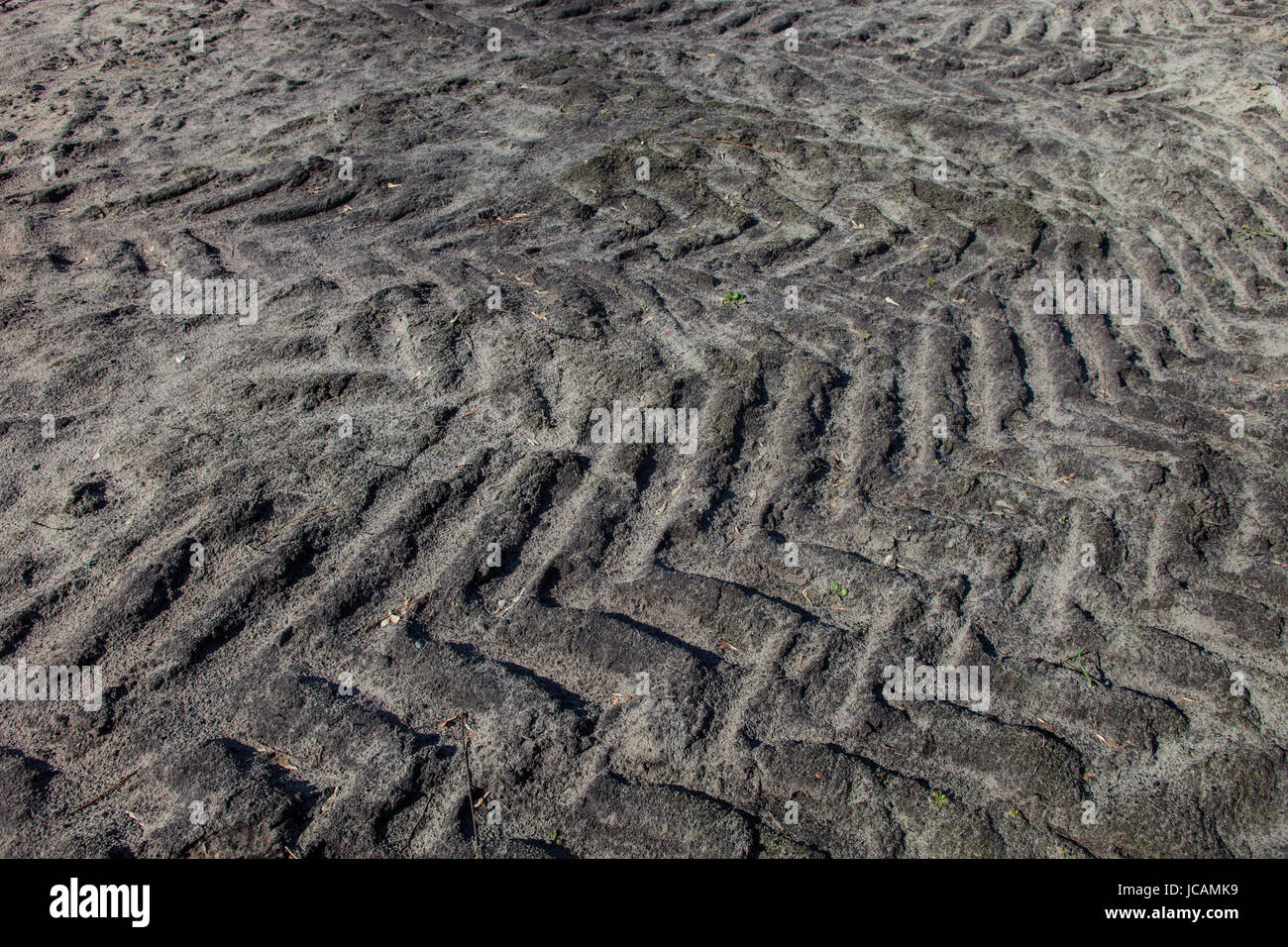 Lots of wheel tracks on the ground Stock Photo - Alamy