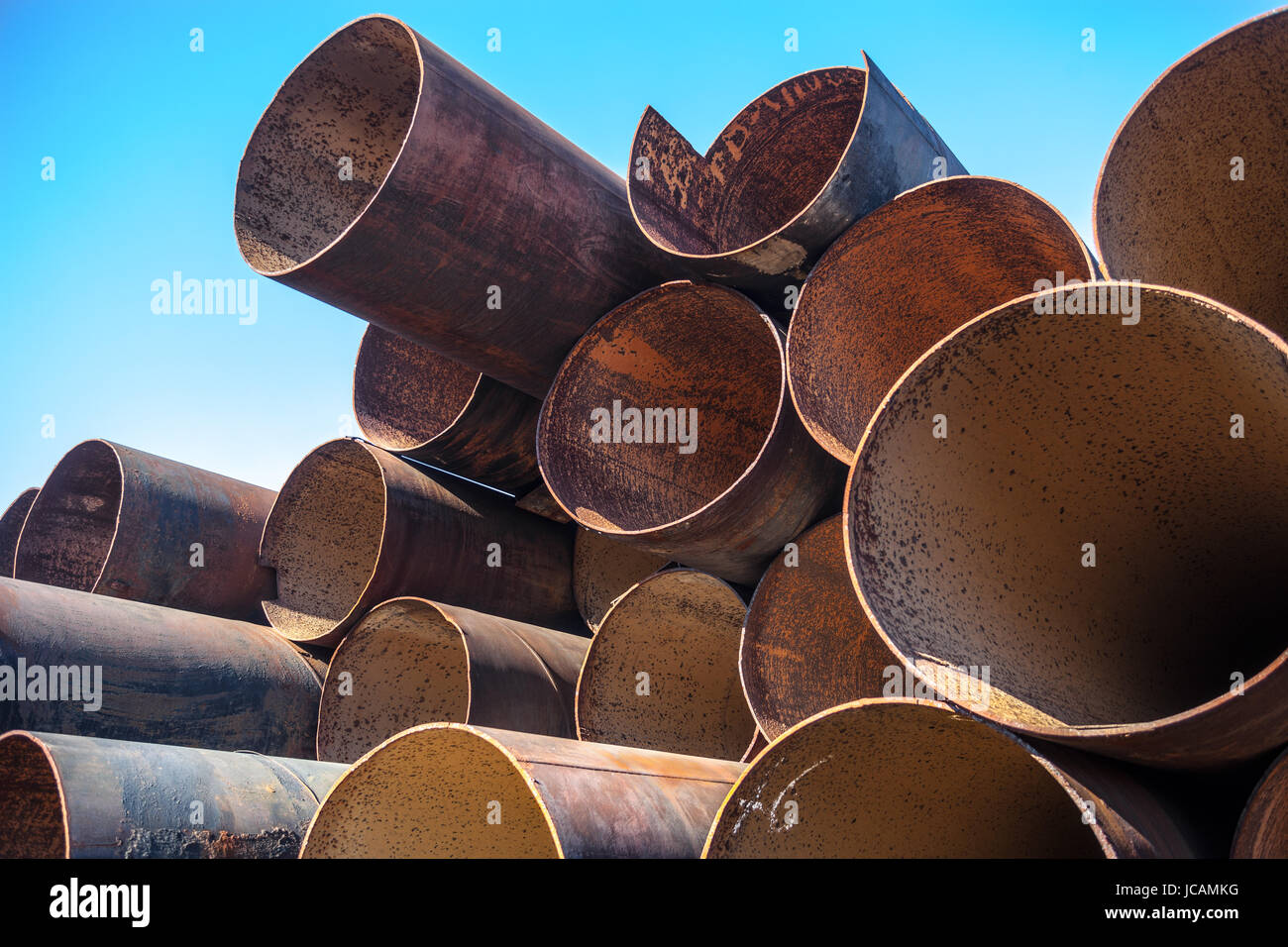 Lots of rusty metal pipes put together Stock Photo - Alamy