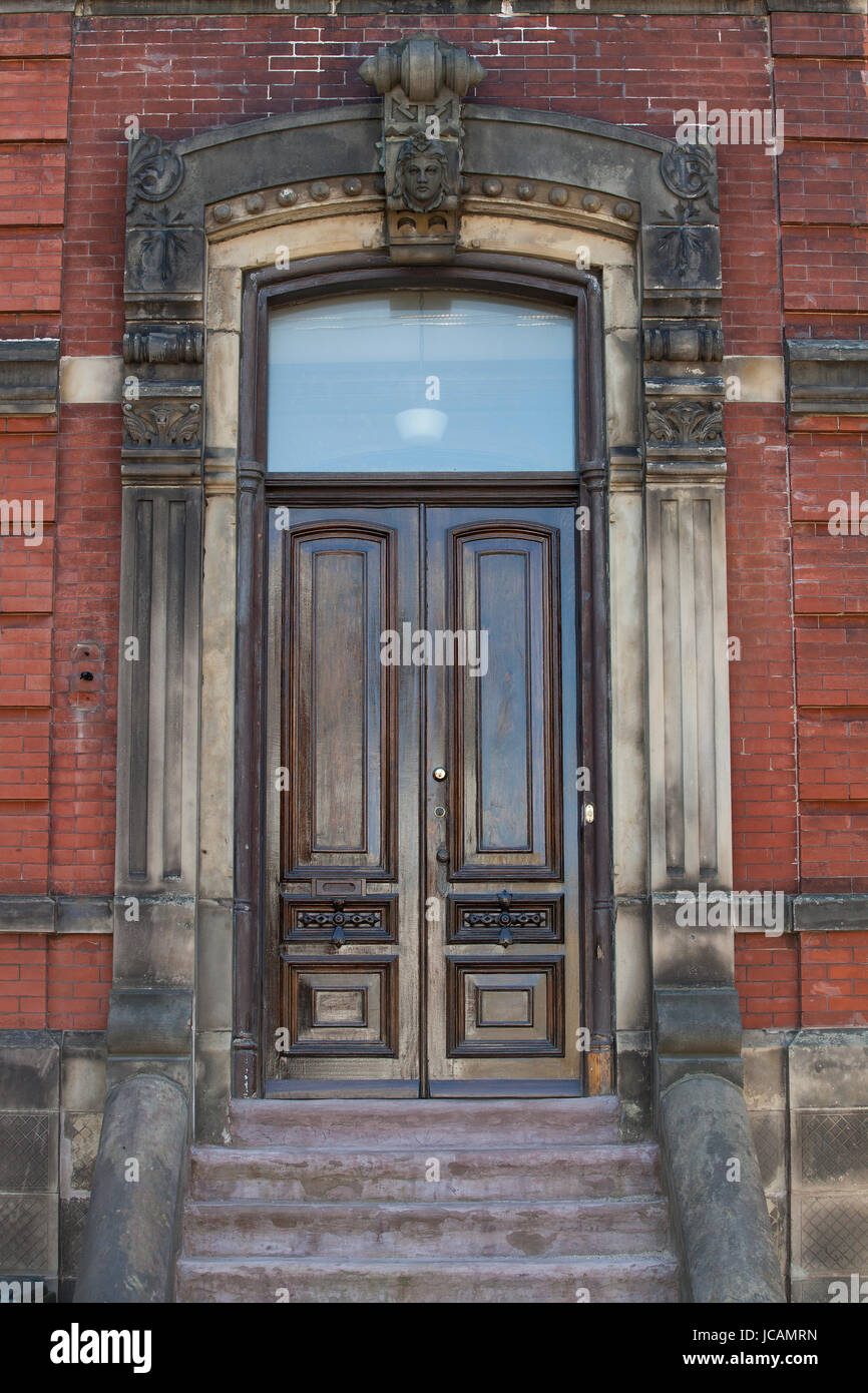 Very old entrance with two wooden doors and beautiful detailed ...